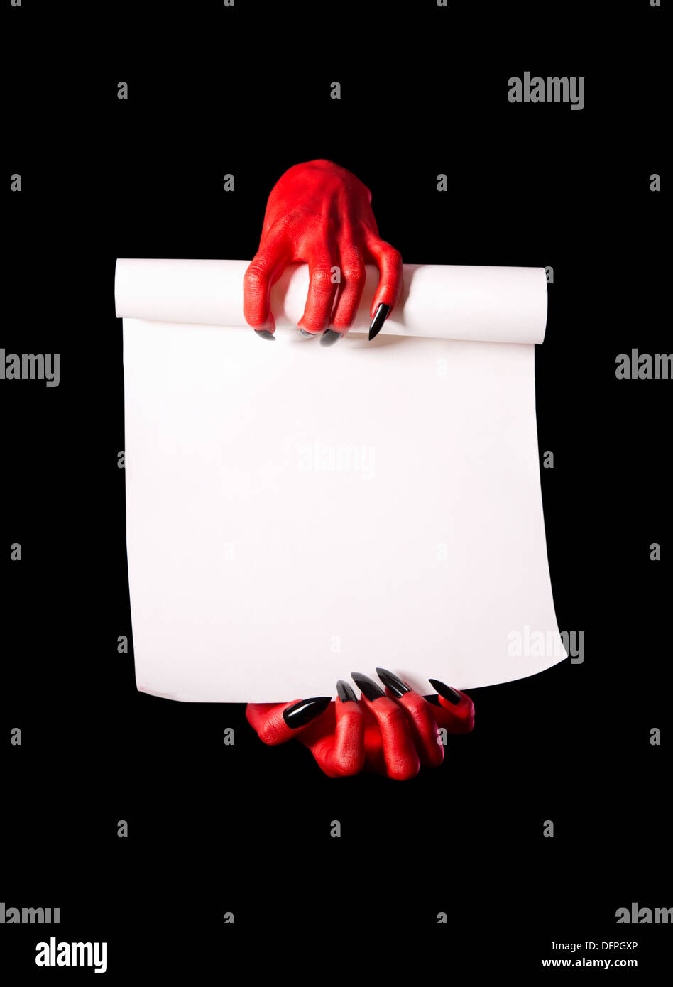 Red devil hands holding paper scroll, deal with devil concept, isolated ...