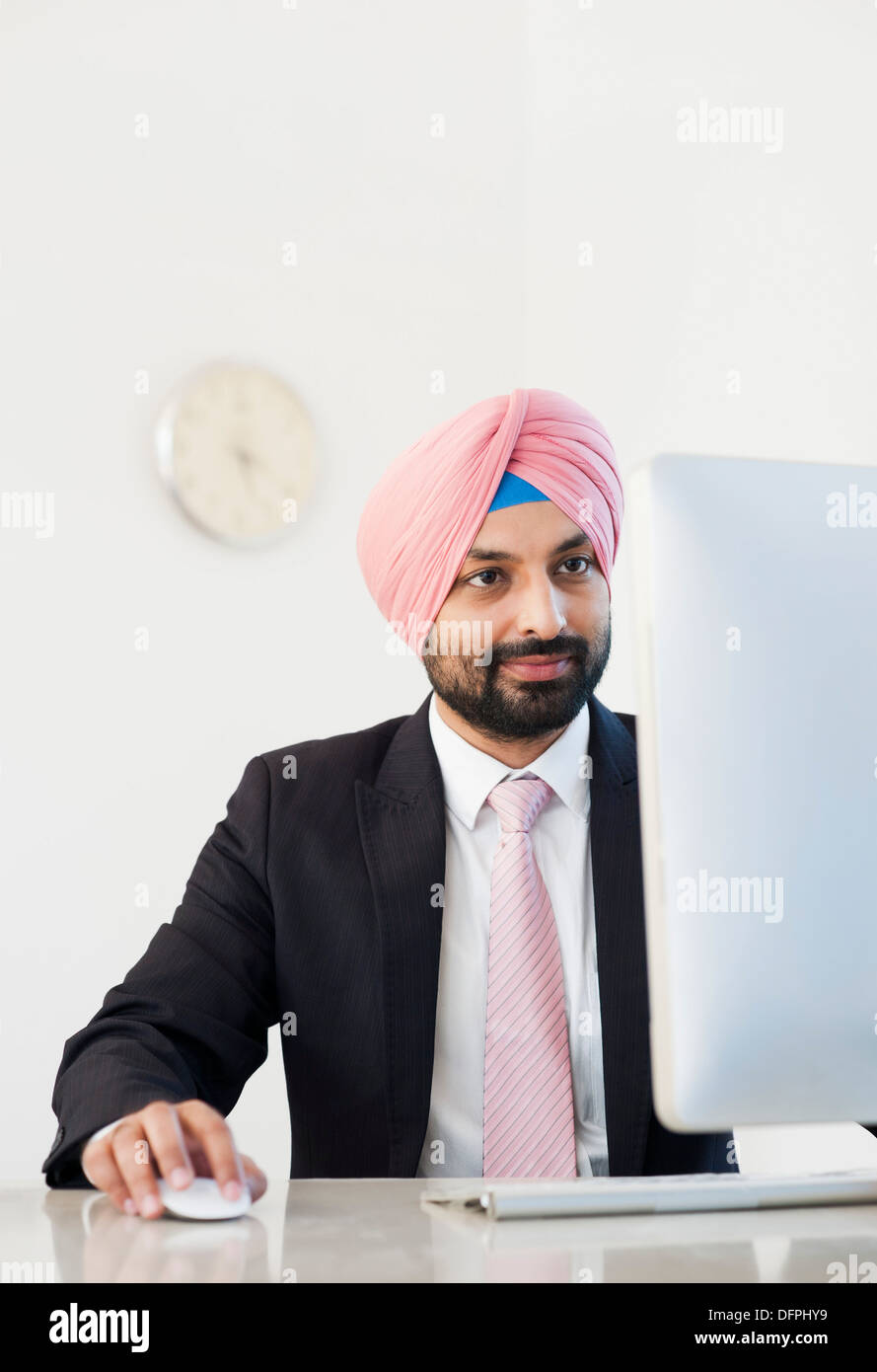 Indian man working at desktop hi-res stock photography and images - Alamy