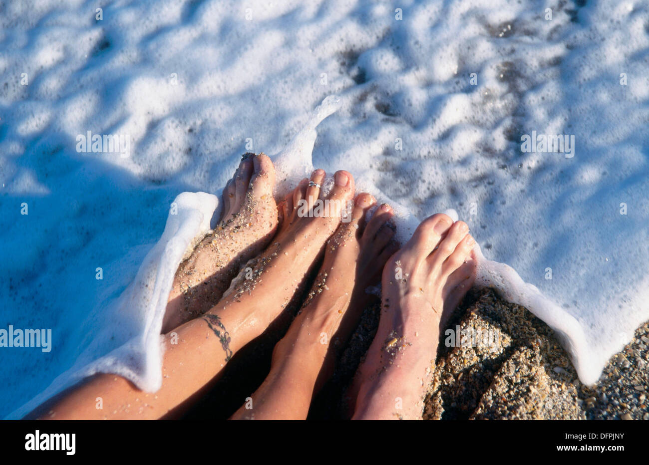 Feet in the surf hi-res stock photography and images - Alamy