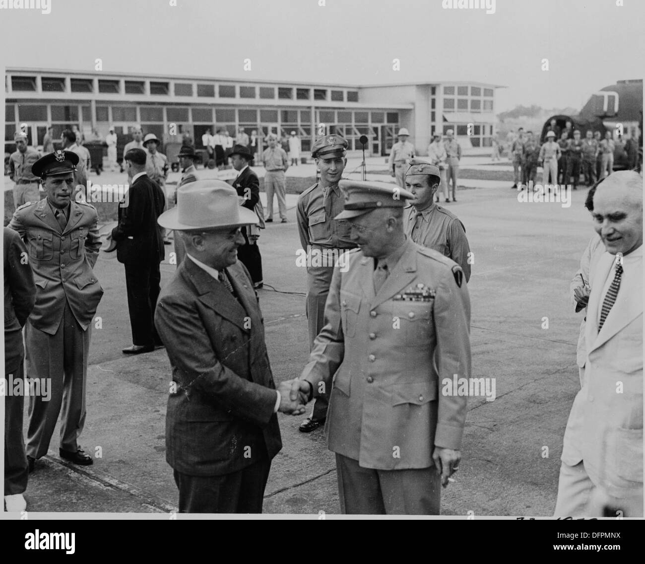 This photograph captures President Harry S. Truman greeting General ...
