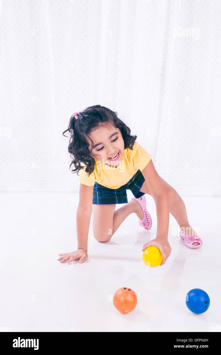 Girl playing colored balls hi-res stock photography and images - Alamy