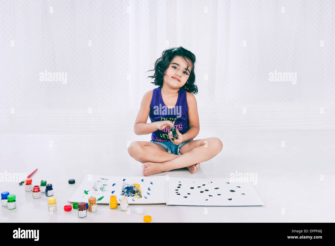 Portrait of a girl painting with water colors Stock Photo - Alamy