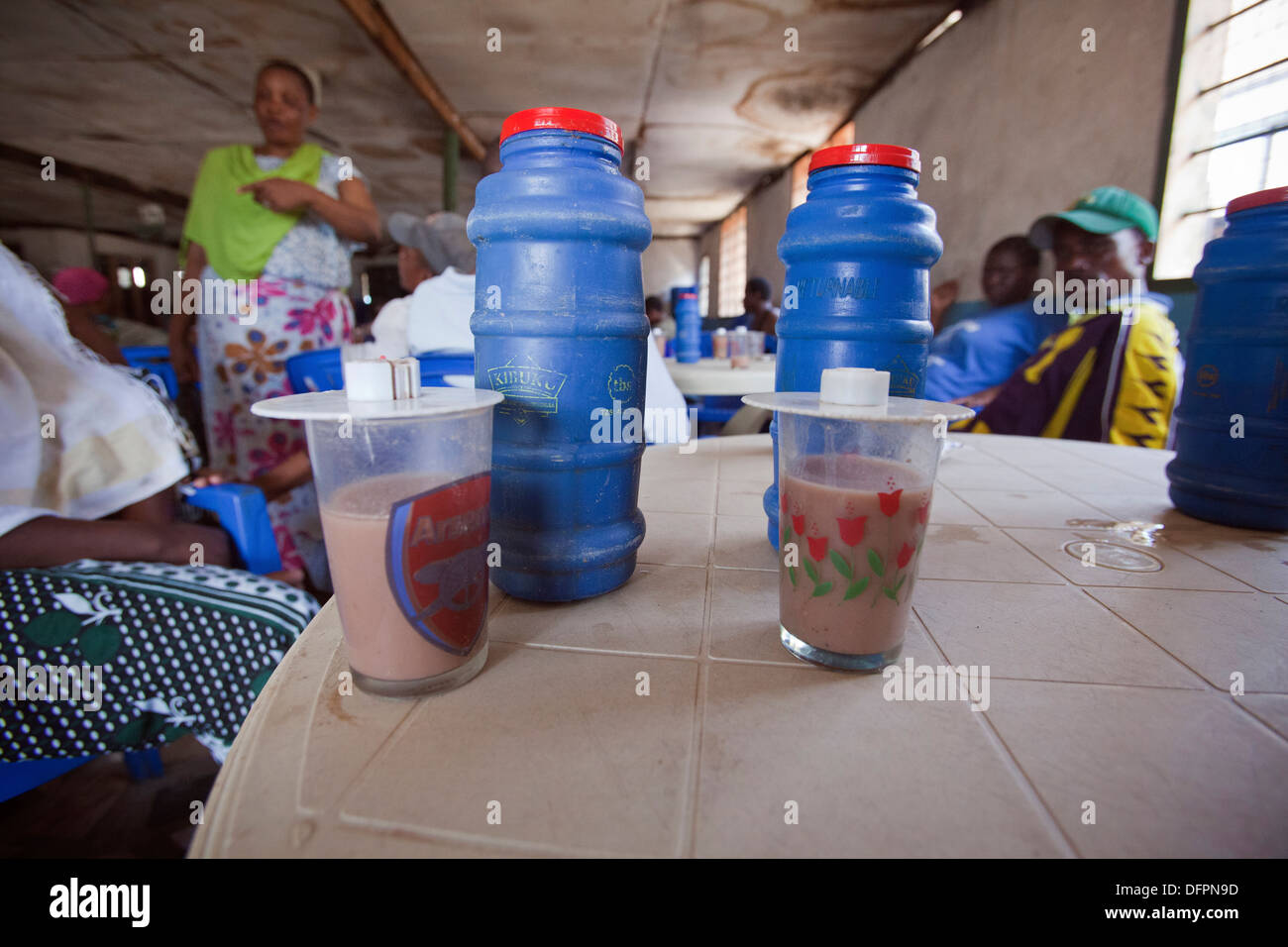 Punters in a local pub with bottles of 'Kibuku' a cheap alcohol sold in ...