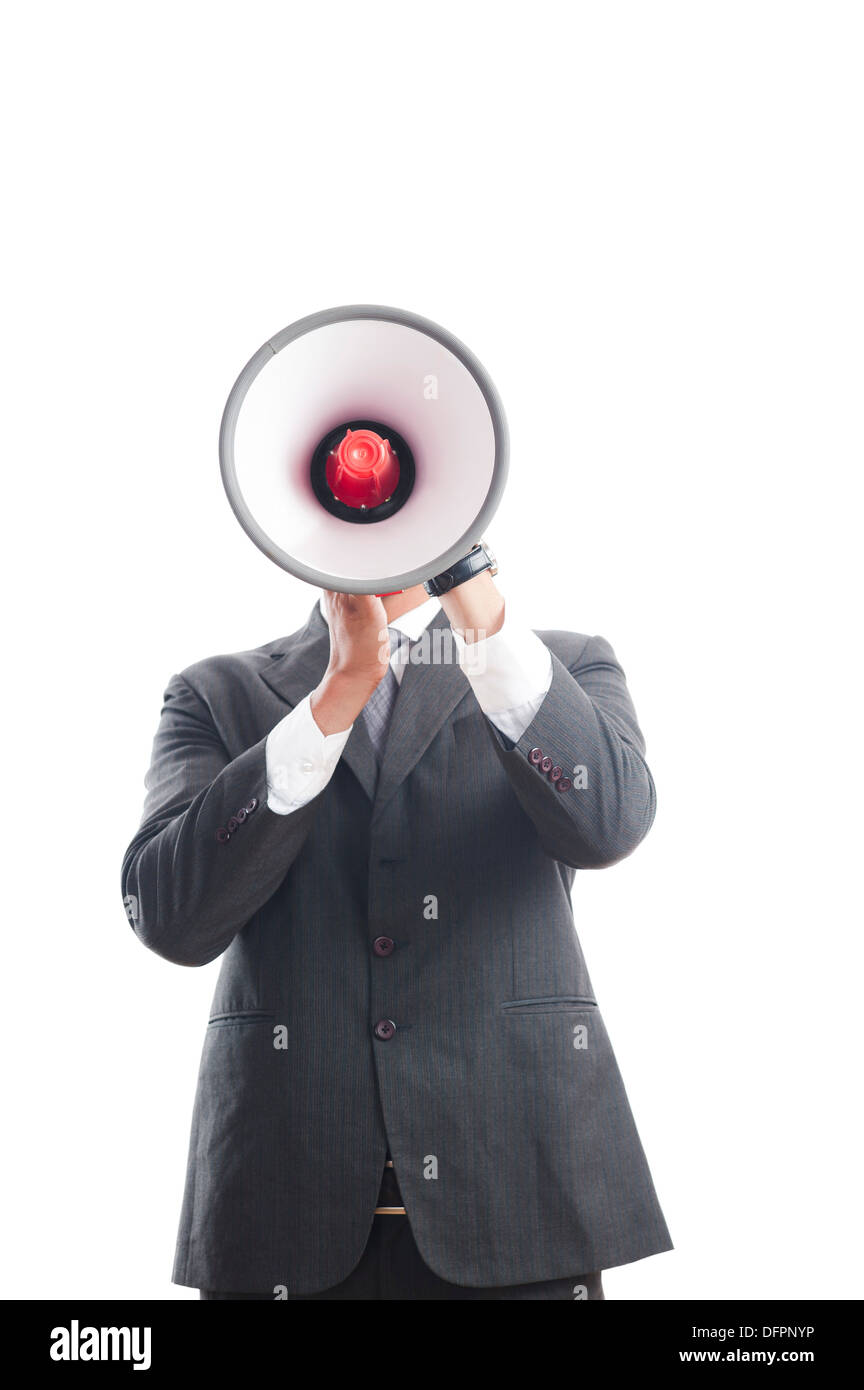 Businessman holding megaphone in front of his face Stock Photo - Alamy