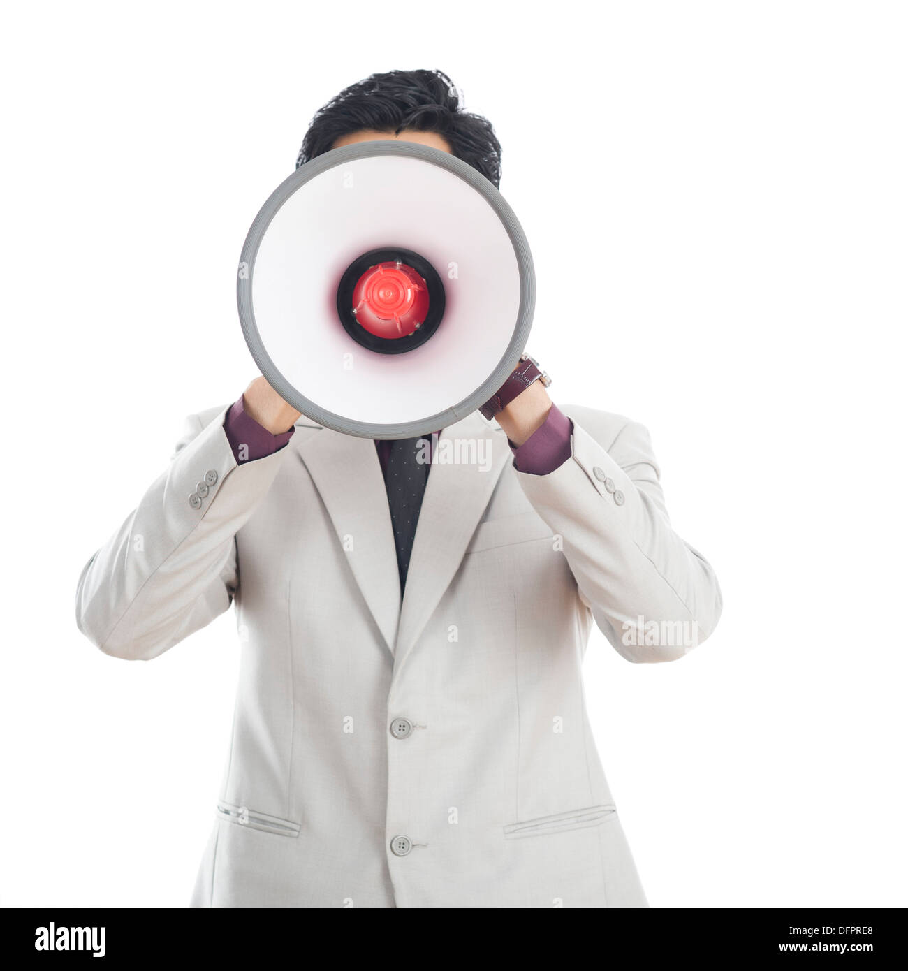 Businessman holding megaphone in front of his face Stock Photo - Alamy