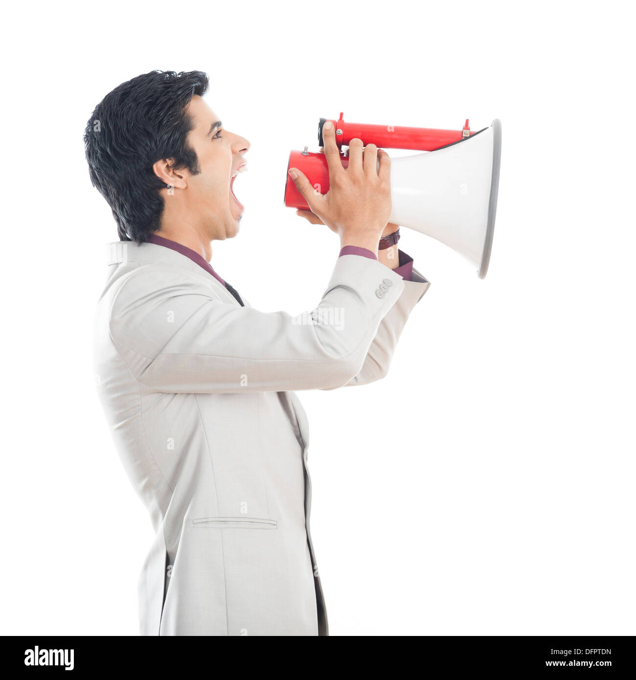 Businessman shouting into a megaphone Stock Photo - Alamy