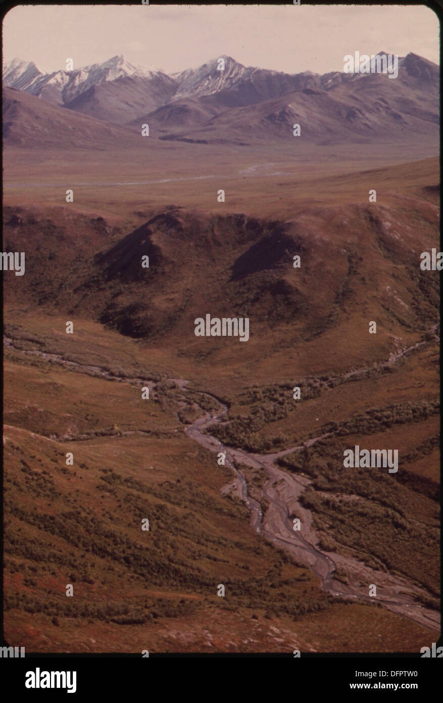 This photograph captures the Chandalar Shelf, an up-lit geological ...