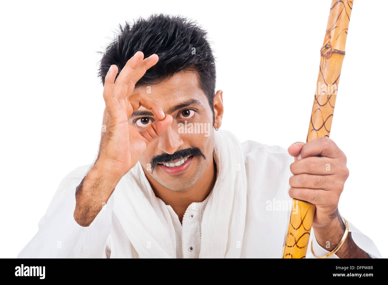 Portrait of a man holding wooden staff and gesturing Stock Photo - Alamy