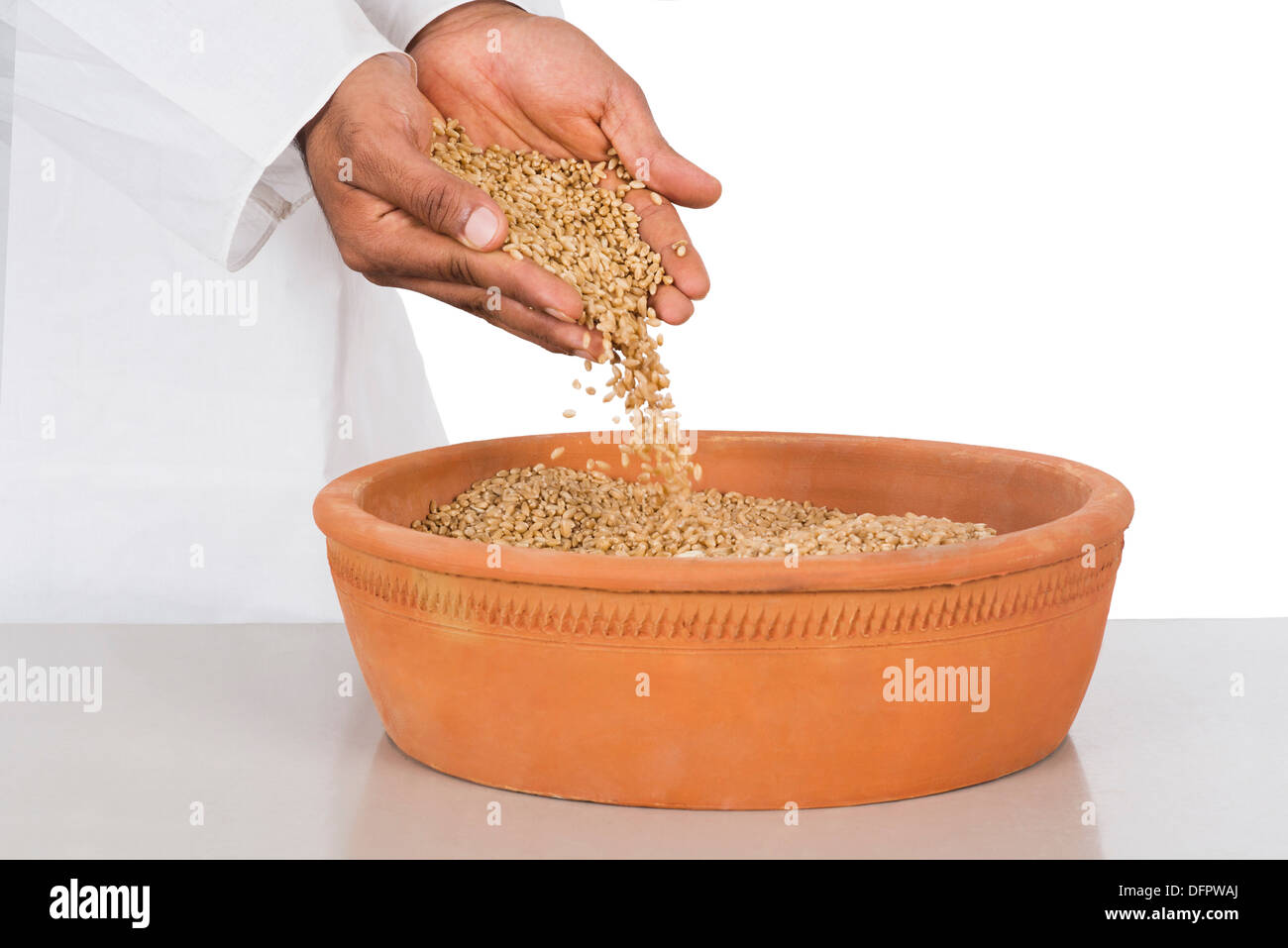 Hand pouring pot hi-res stock photography and images - Alamy