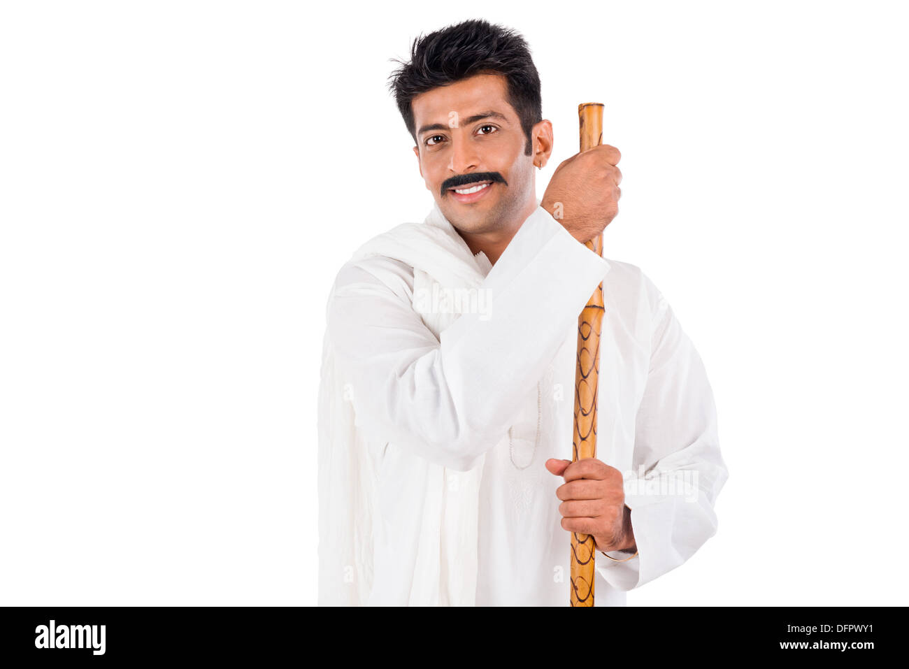 Portrait of a man holding a wooden staff Stock Photo - Alamy