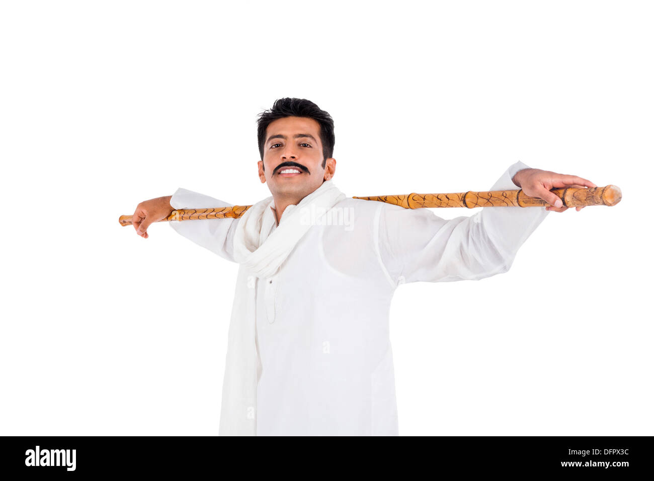 Portrait of a man keeping wooden staff on his shoulders Stock Photo - Alamy