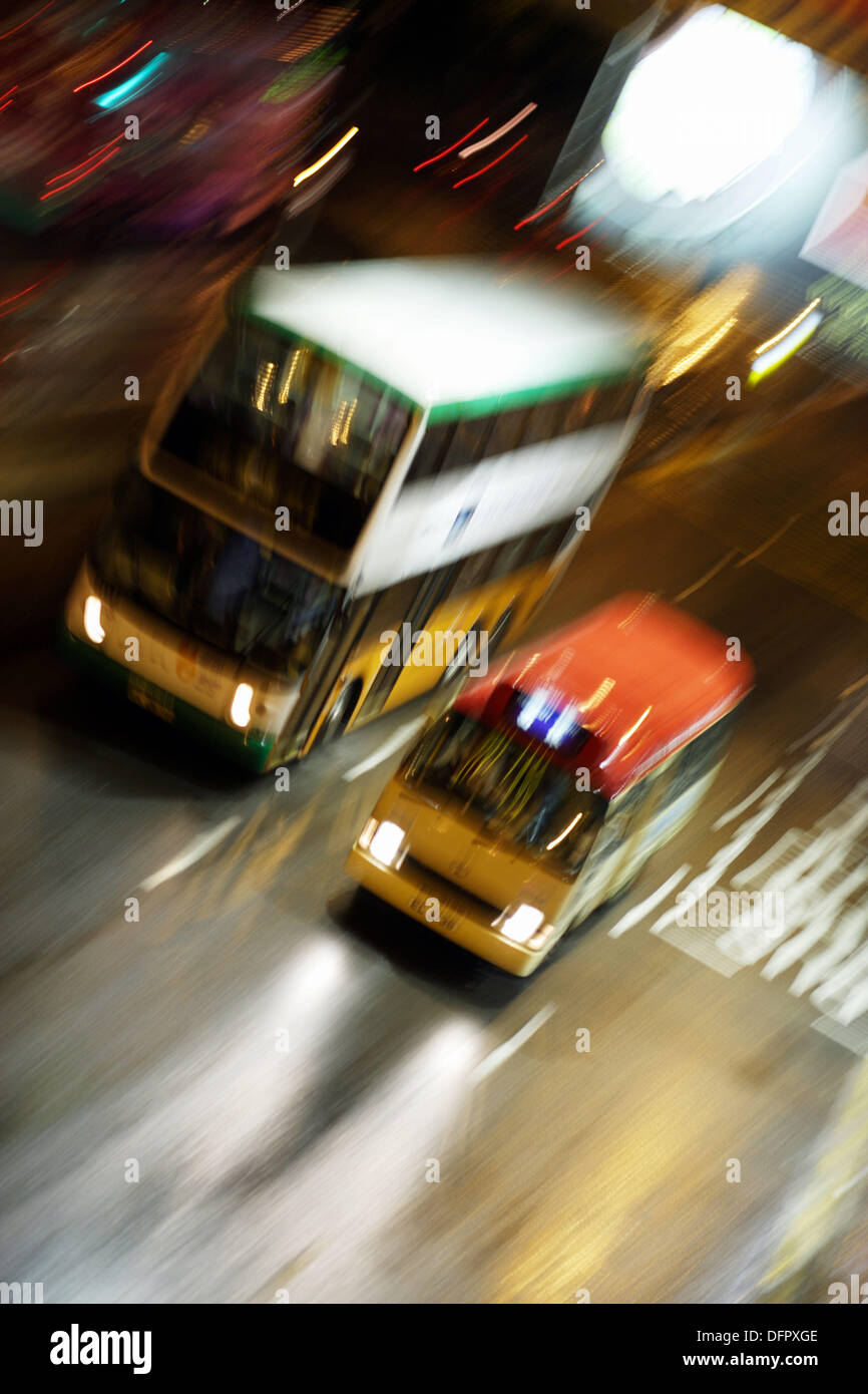 Two public busses, one typical doubledecker and one minibus, besides ...