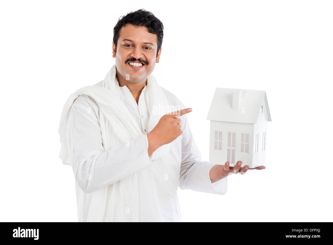 Portrait of a smiling man pointing at a model home Stock Photo - Alamy