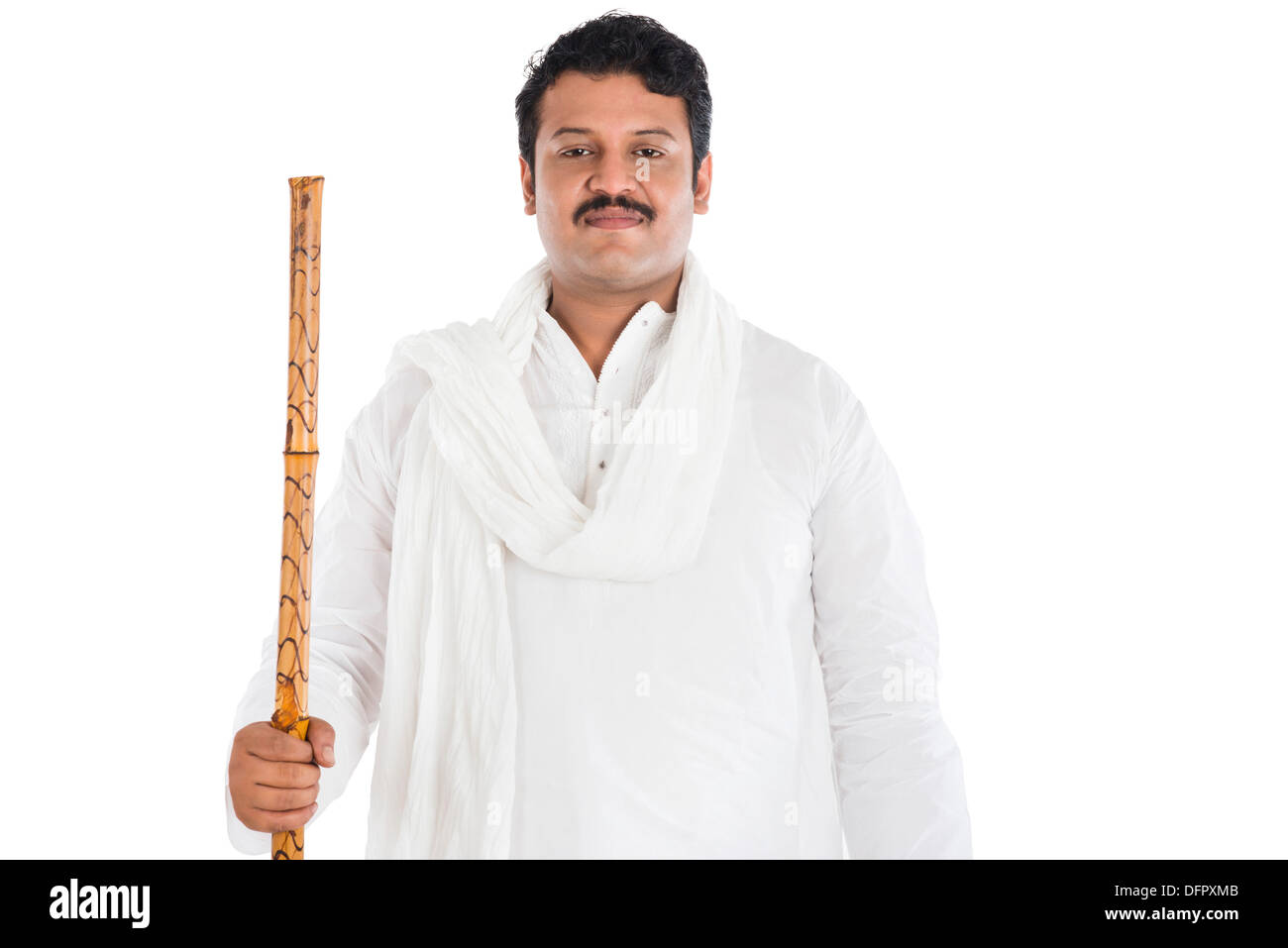 Portrait of a man holding wooden staff Stock Photo - Alamy