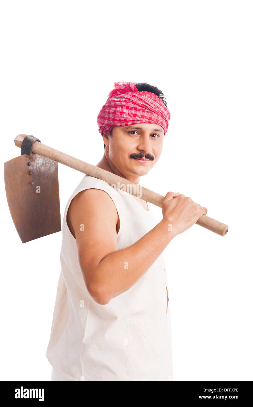 Portrait of a farmer carrying spade on his shoulders Stock Photo - Alamy
