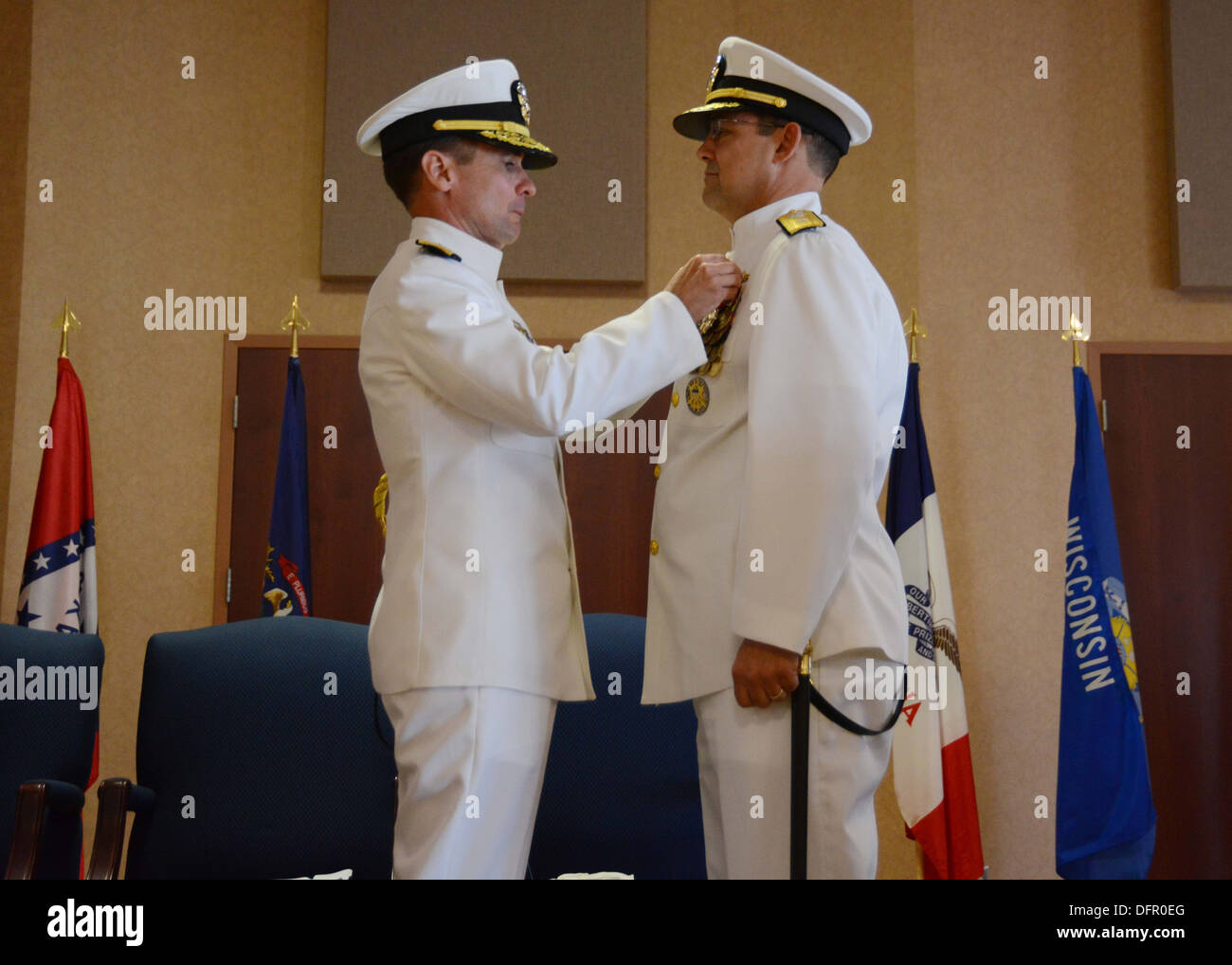 Rear Adm. John Kirby, Chief of Information, pins the Legion of Merit ...