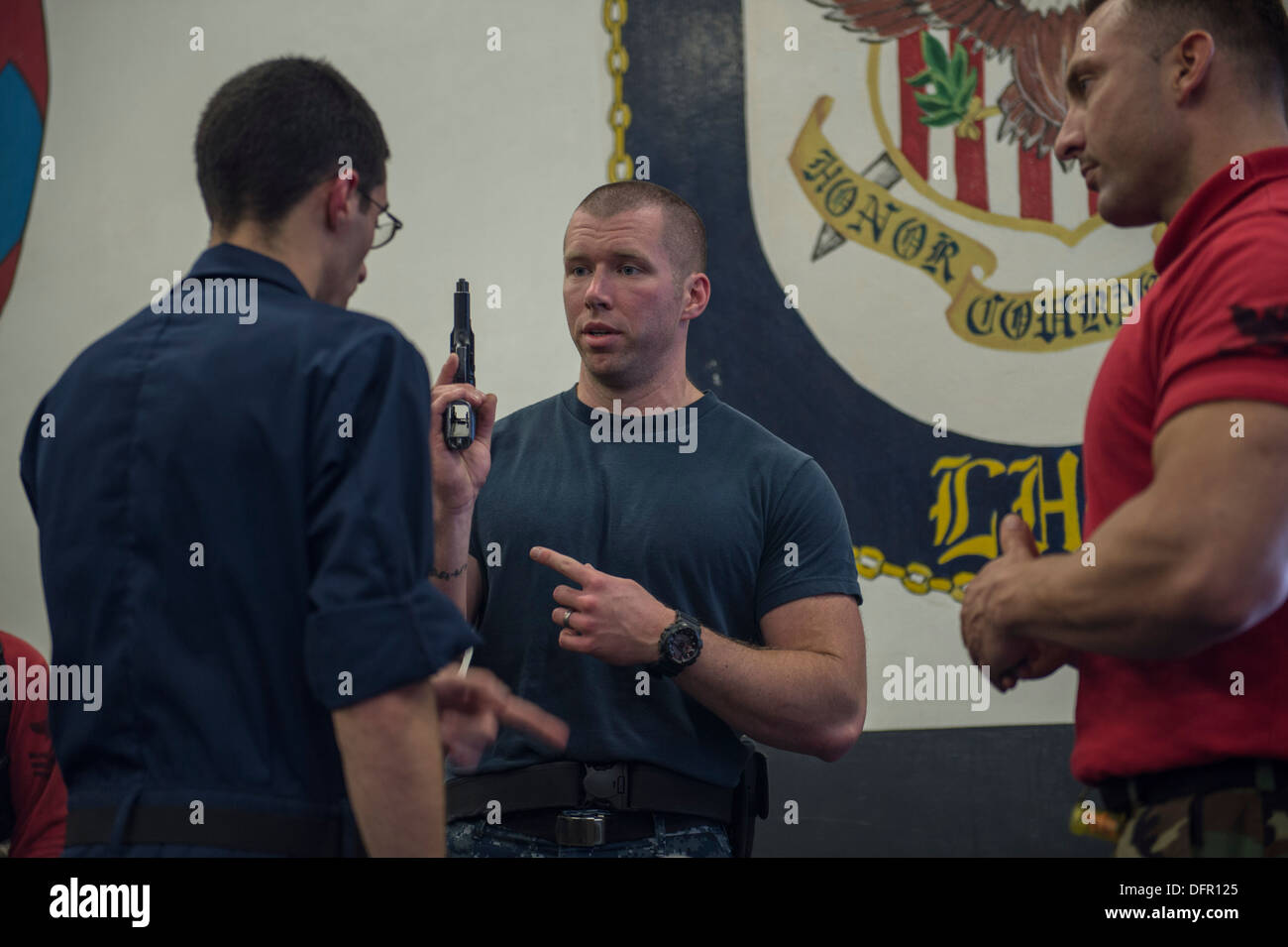 Gunners Mate 3rd Class Levi Horn gives weapons training aboard the ...