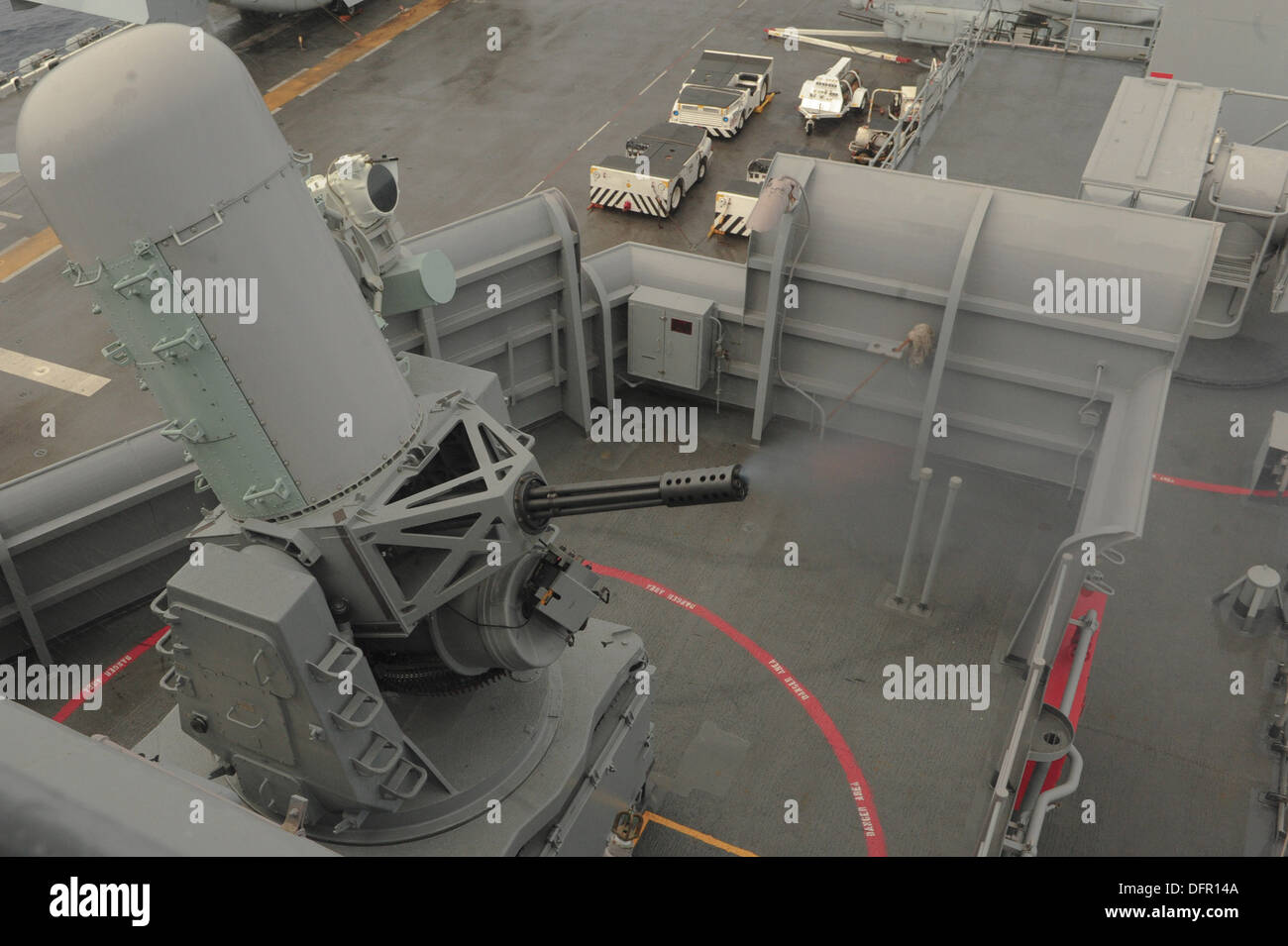 A close-in weapons system conducts a test fire aboard the amphibious ...