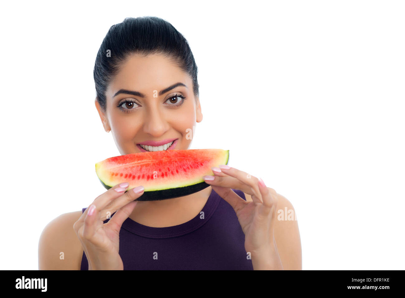 Portrait of a woman eating watermelon Stock Photo - Alamy