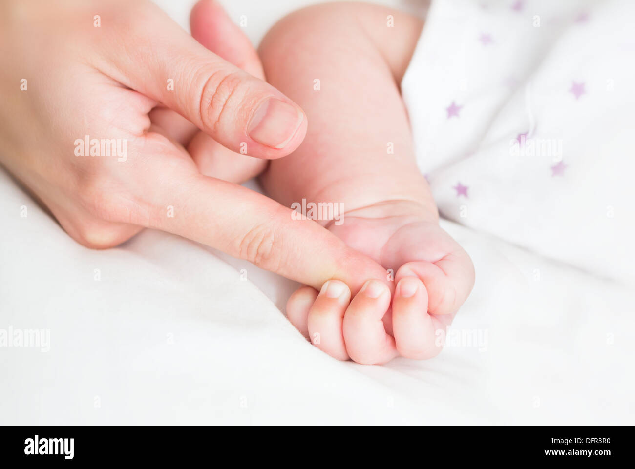 Baby hand holding mothers finger hi-res stock photography and images ...