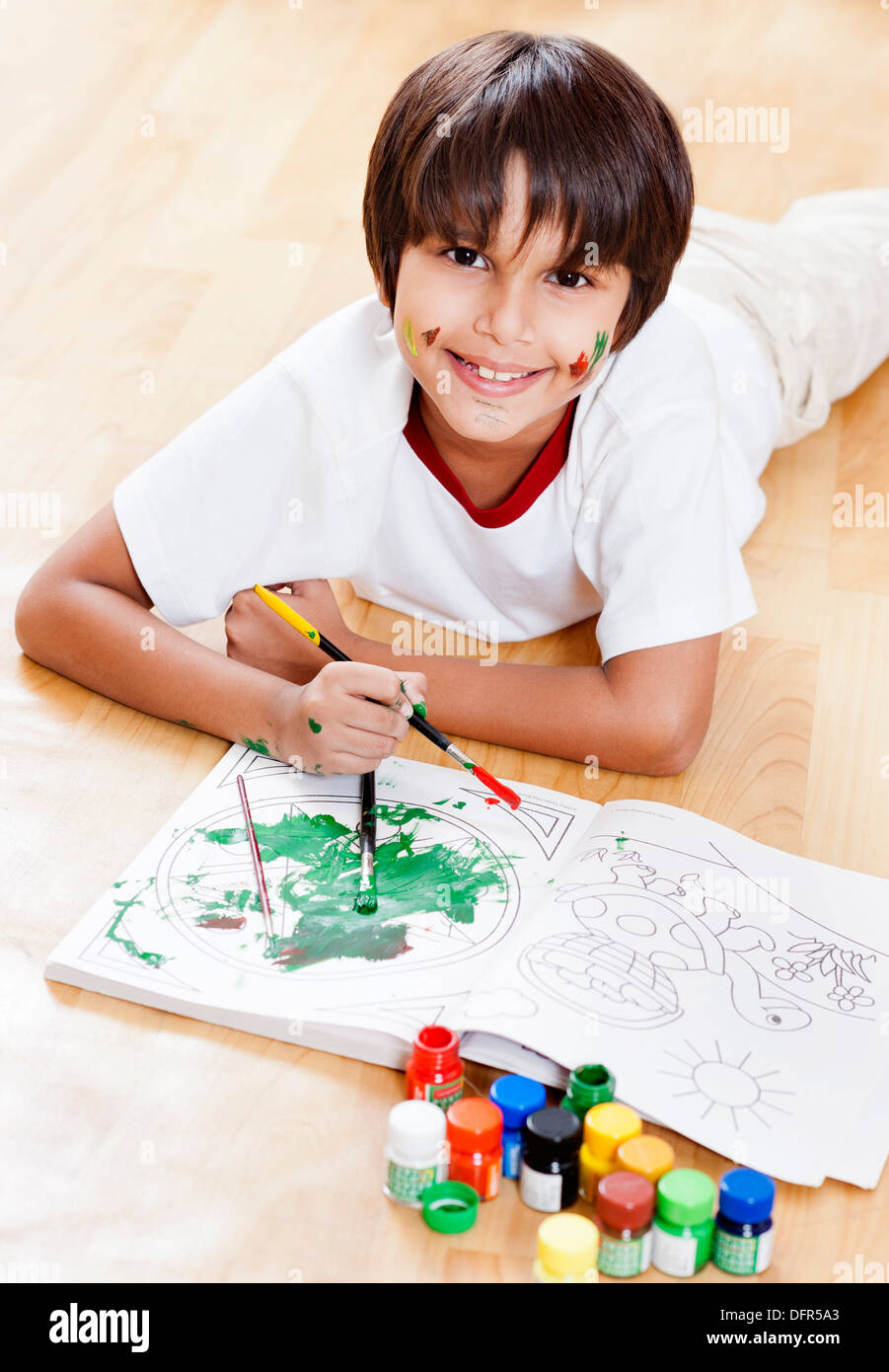 Portrait of a boy painting Stock Photo - Alamy