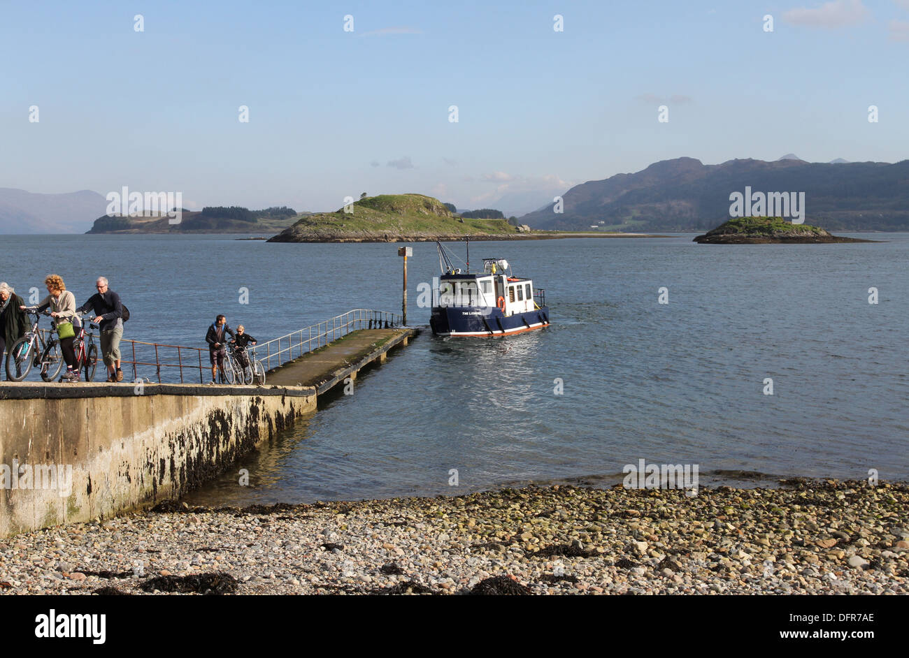 Passengers departing Lismore ferry docked in isle of Lismore Scotland ...