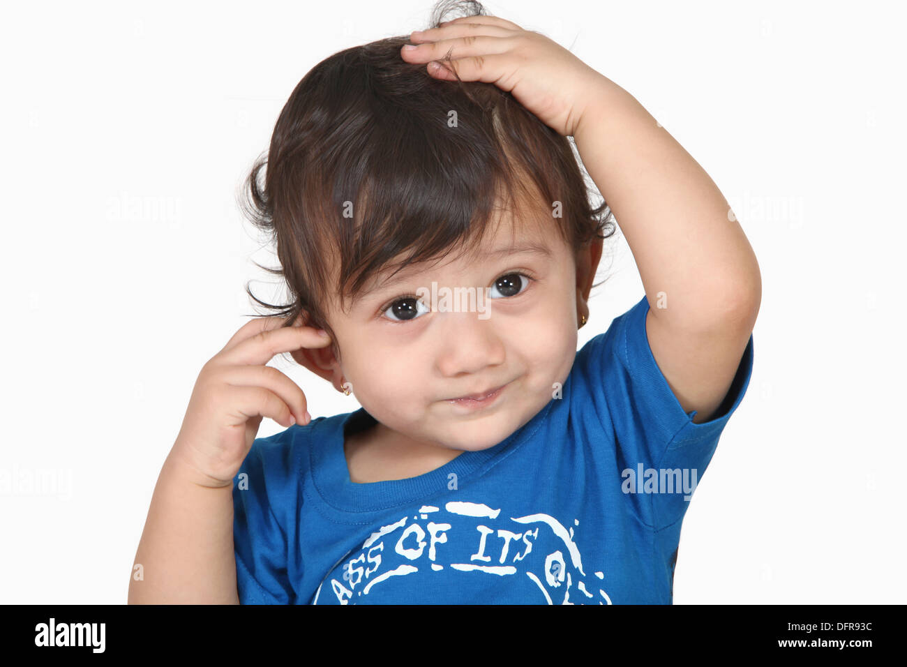 A 3 year old boy scratching his head Stock Photo - Alamy