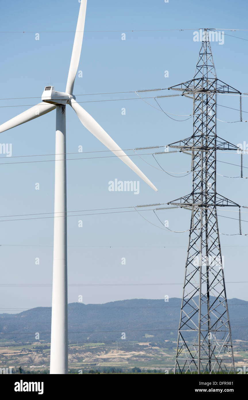 windmill for removable energy production and pylon Stock Photo - Alamy
