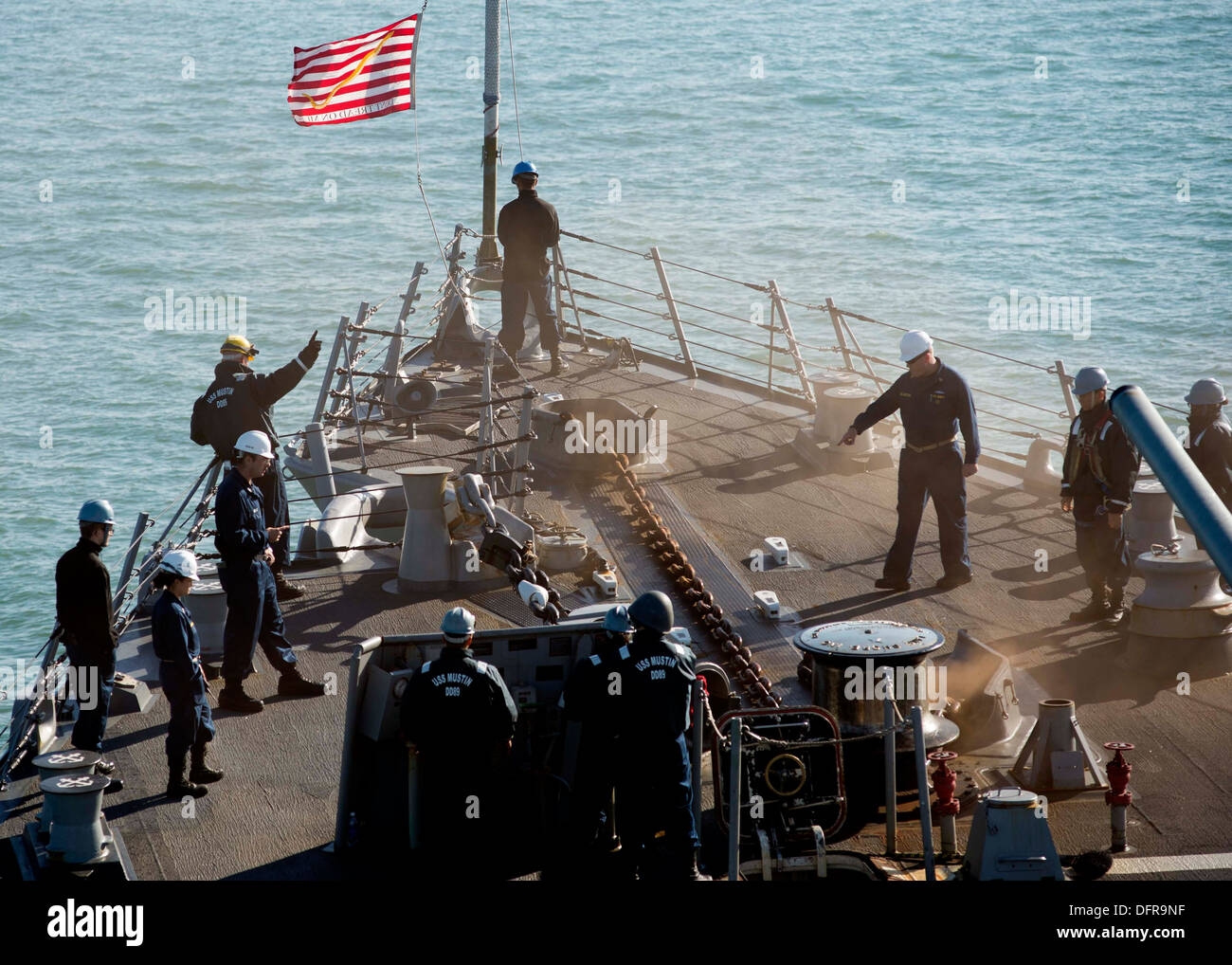 Sailors release the anchor during a sea and anchor detail aboard the ...