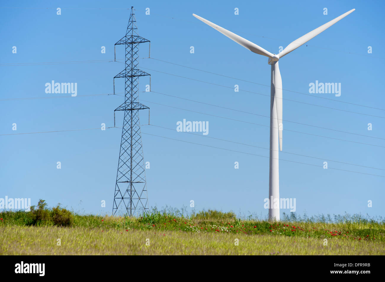 windmill for removable energy production and pylon Stock Photo - Alamy