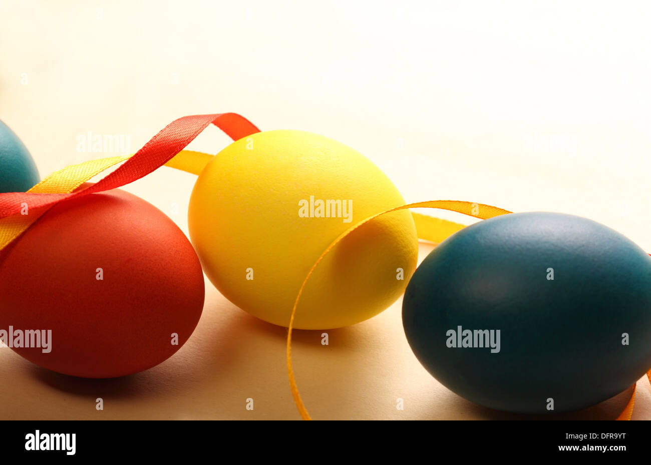 Easter eggs with yellow ribbon Stock Photo - Alamy