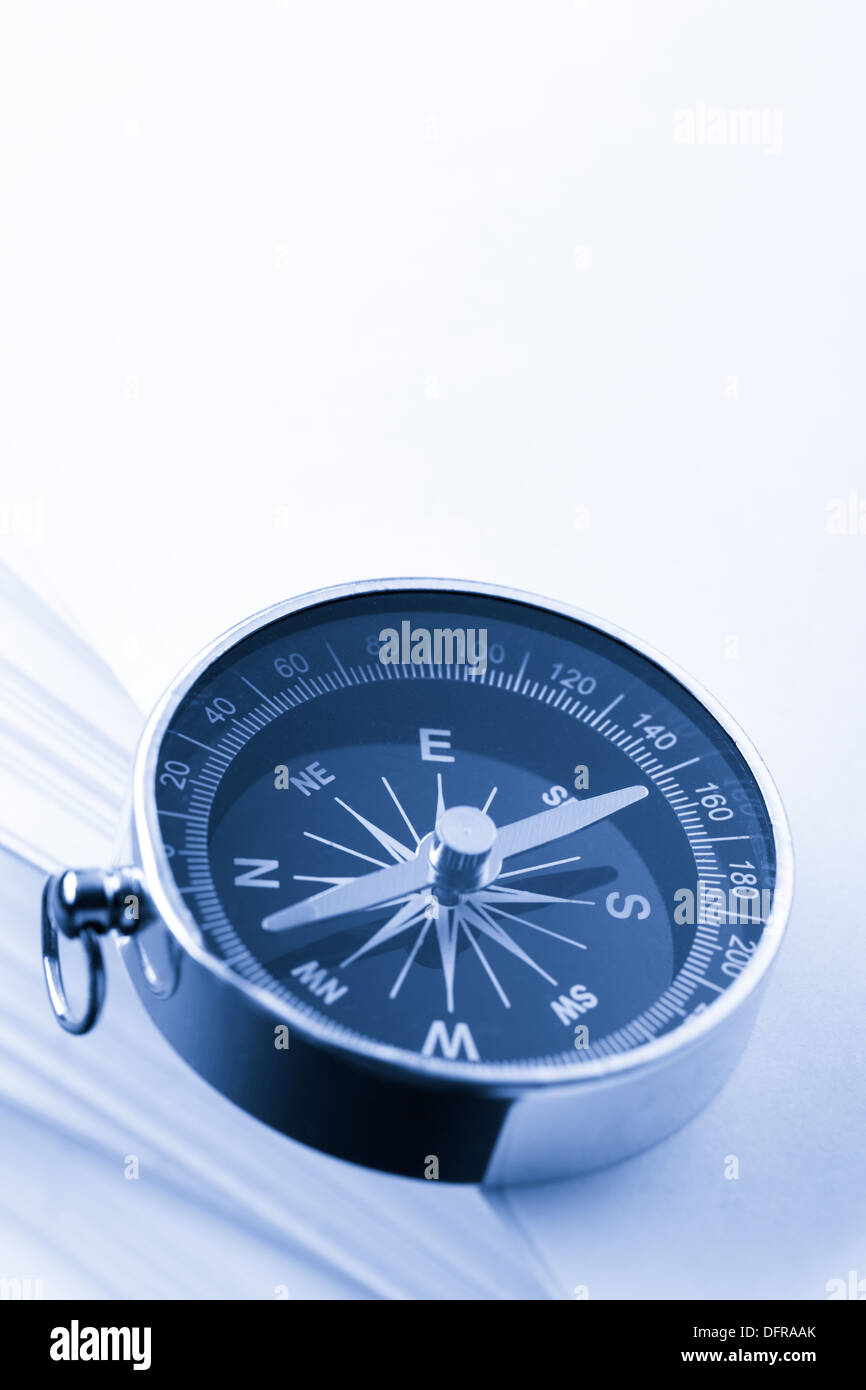 Stack of white cards and compass Stock Photo - Alamy