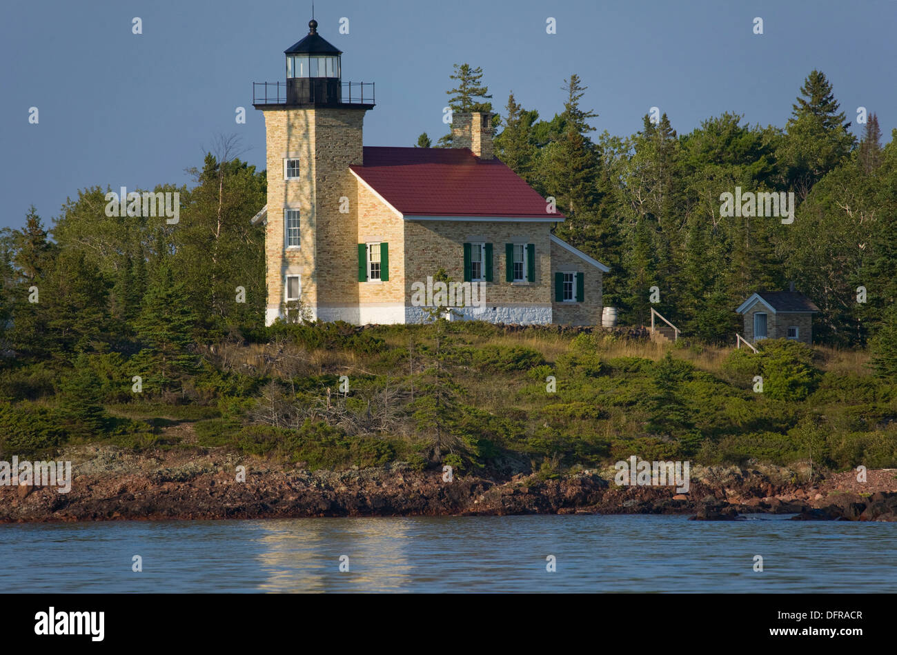 The older Copper Harbor Lighthouse as seen from a tour boat close to ...