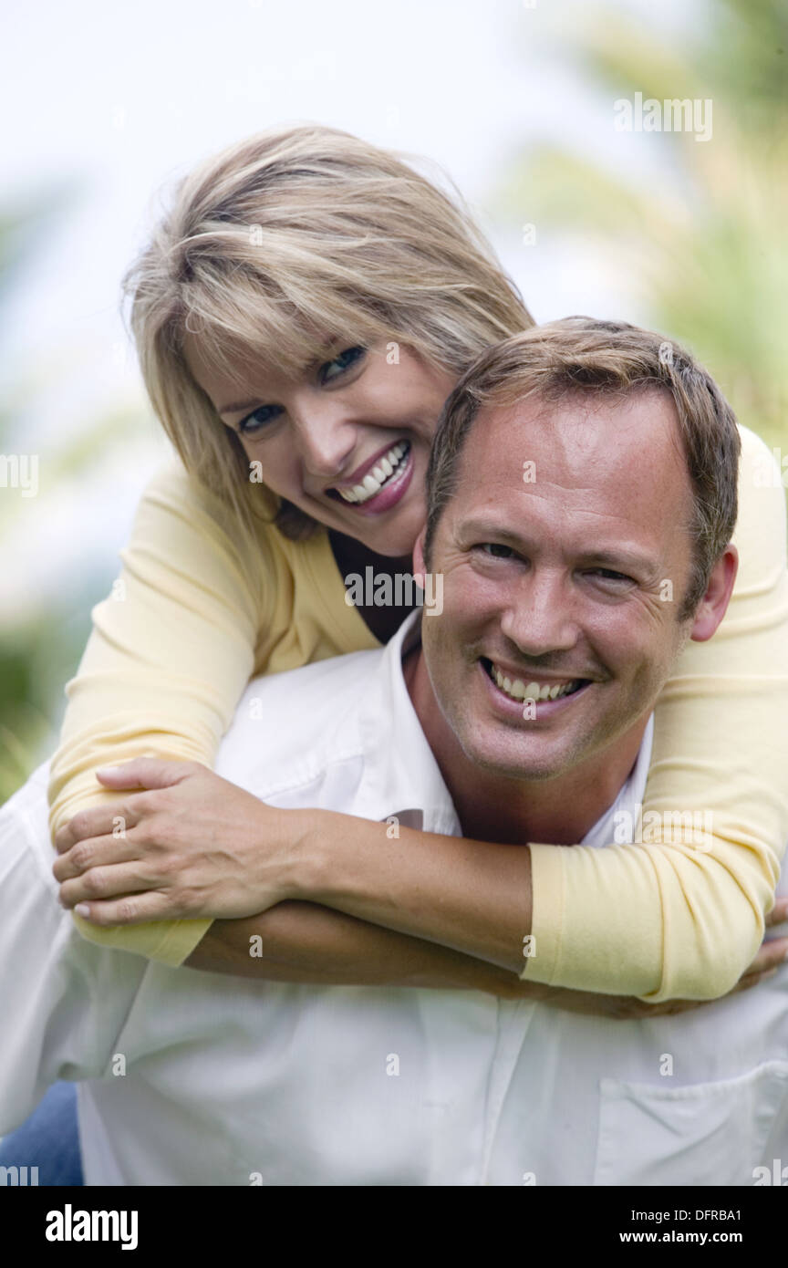 Woman riding on mans back hi-res stock photography and images - Alamy