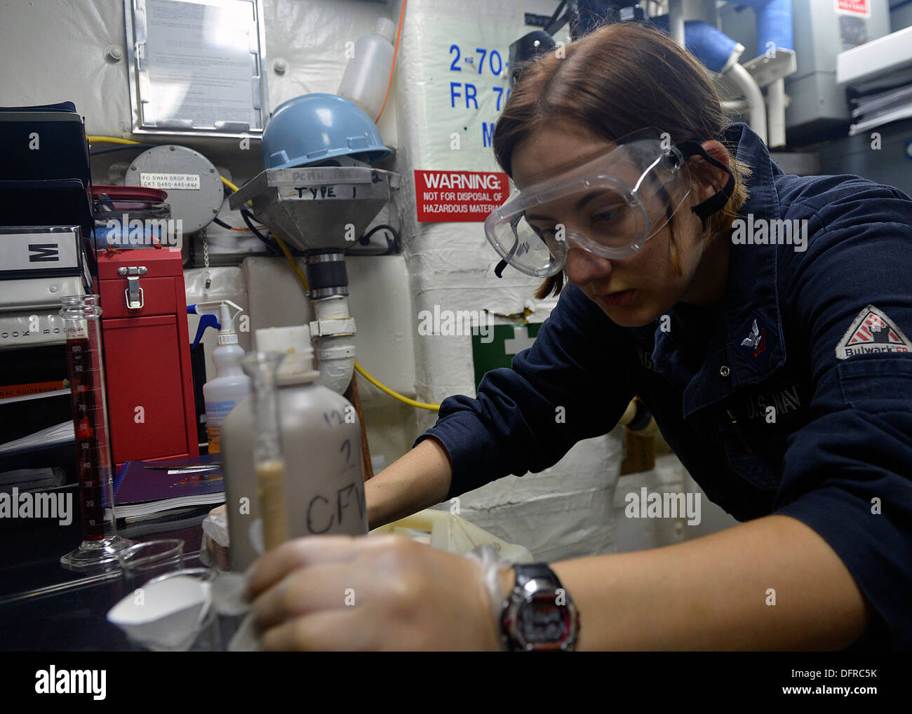 Engineman 2nd Class Larissa Ringel performs a chloride test on jacket ...