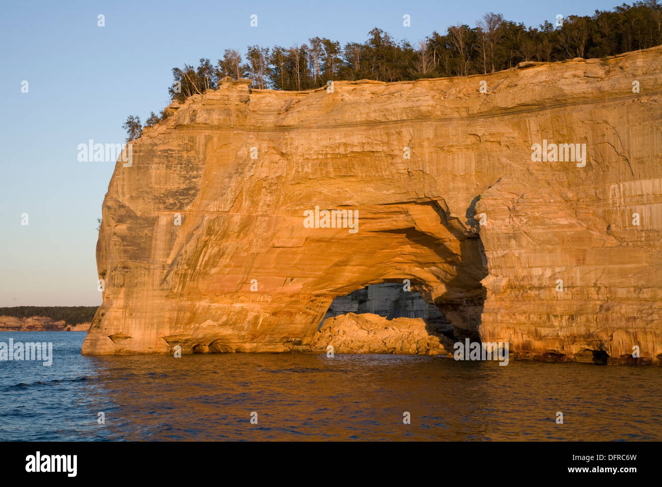 A natural arch in the Pictured Rocks as seen from a tourboat in the ...