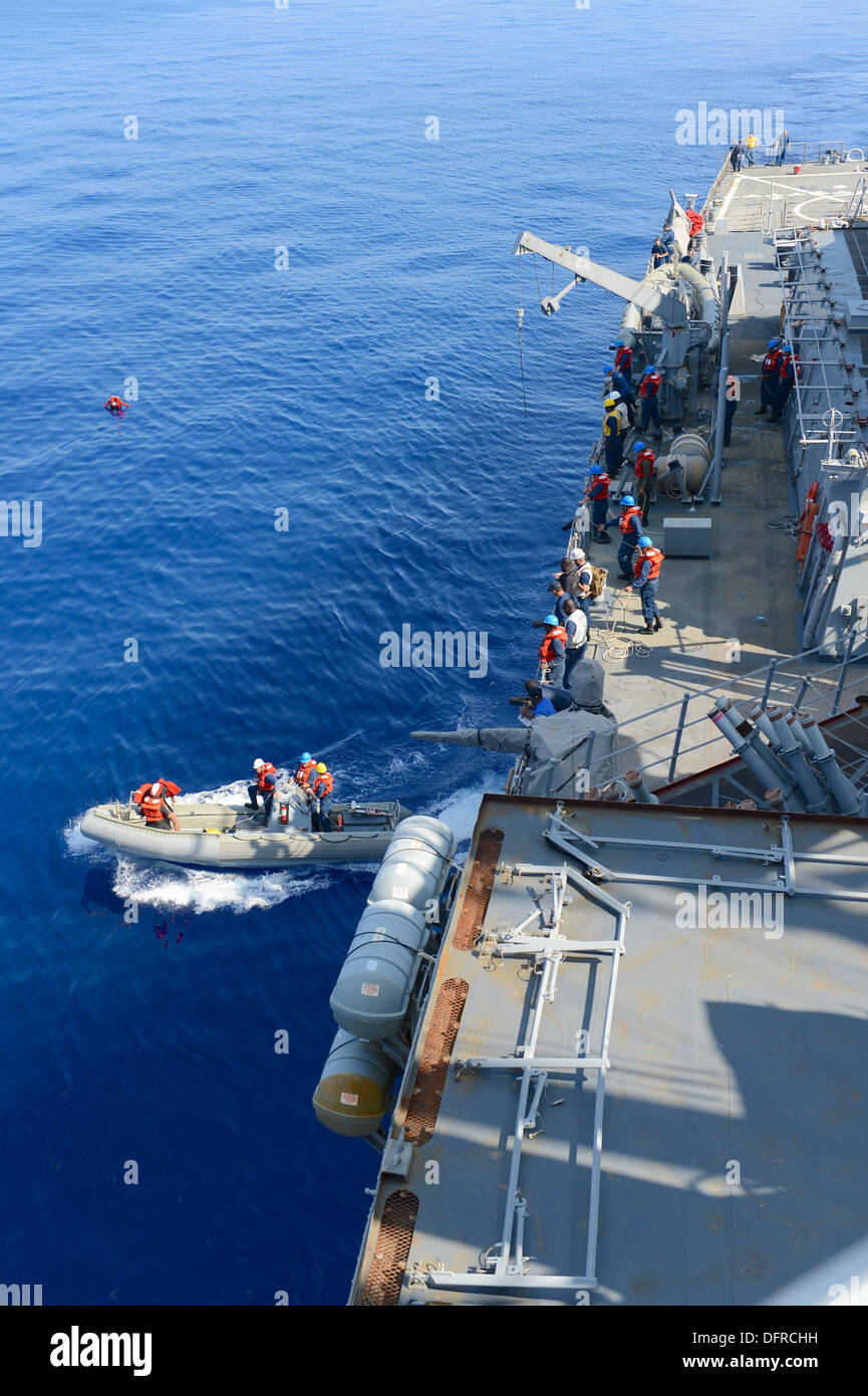 Sailors aboard the guided-missile destroyer USS Ramage (DDG 61) conduct ...