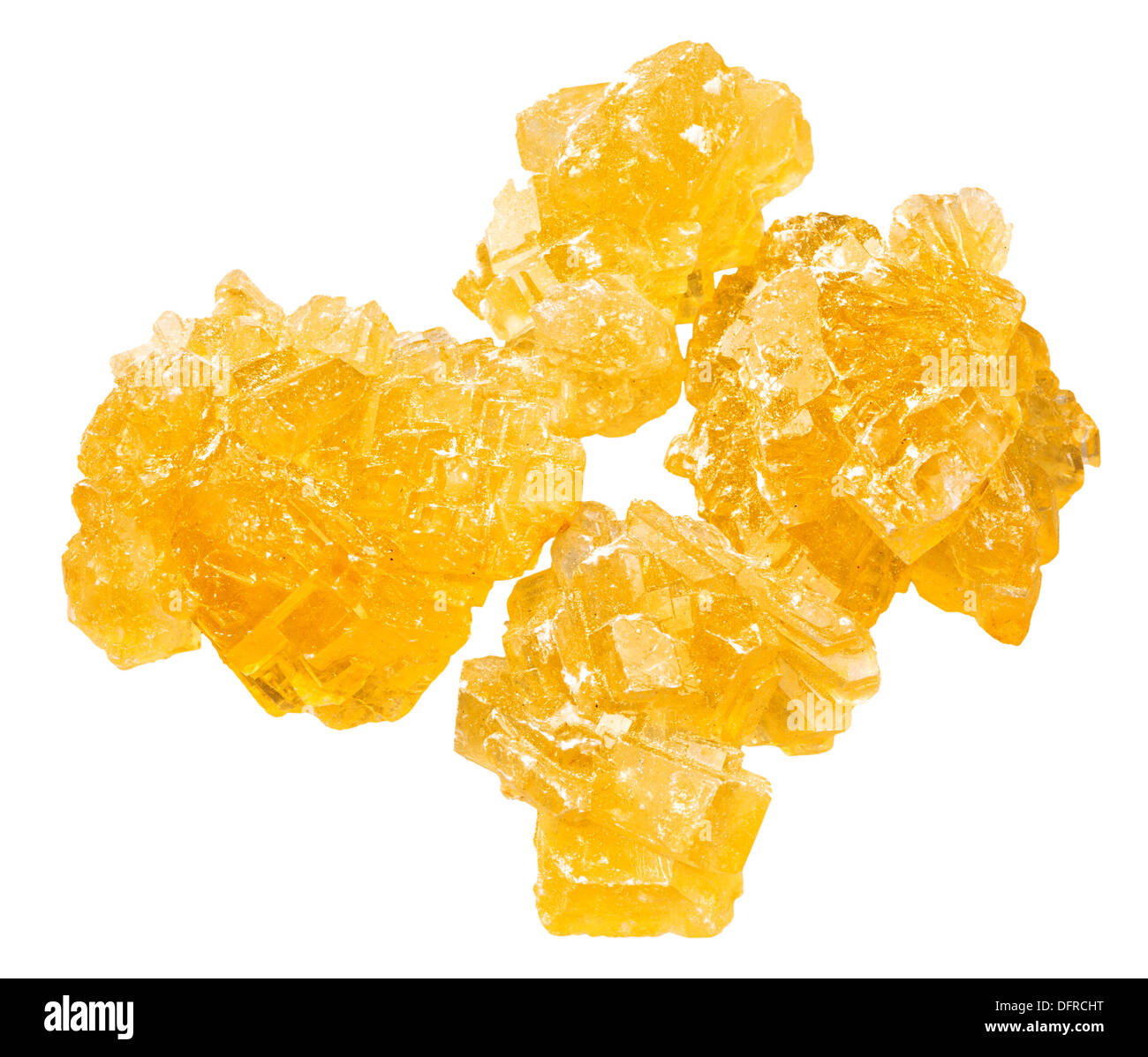 yellow crystalline caramelized sugar isolated on white background Stock ...