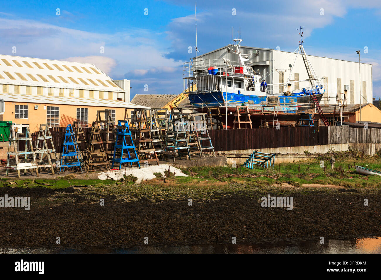 Fishing trawler in dry dock being repaired at the shipbuilders yard ...