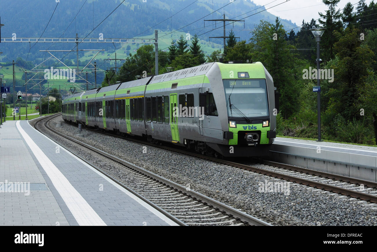 BLS passenger train for Bern arriving at Mulenen station, Switzerland ...