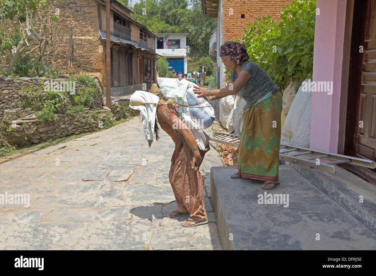 Female carrying heavy load on hi-res stock photography and images - Alamy