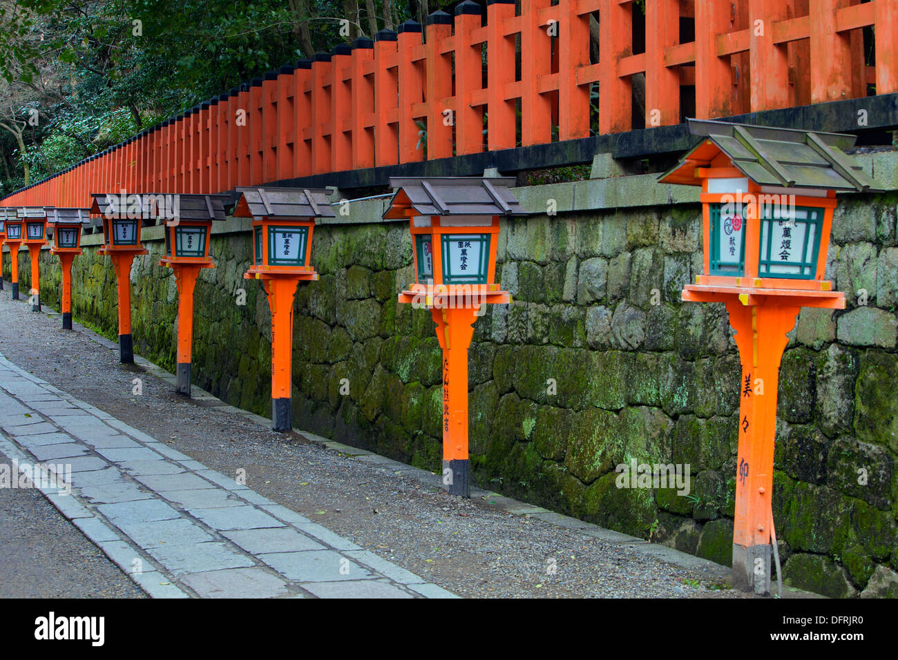 An orange fence and temple lights behind Yasaka Shrine Stock Photo - Alamy