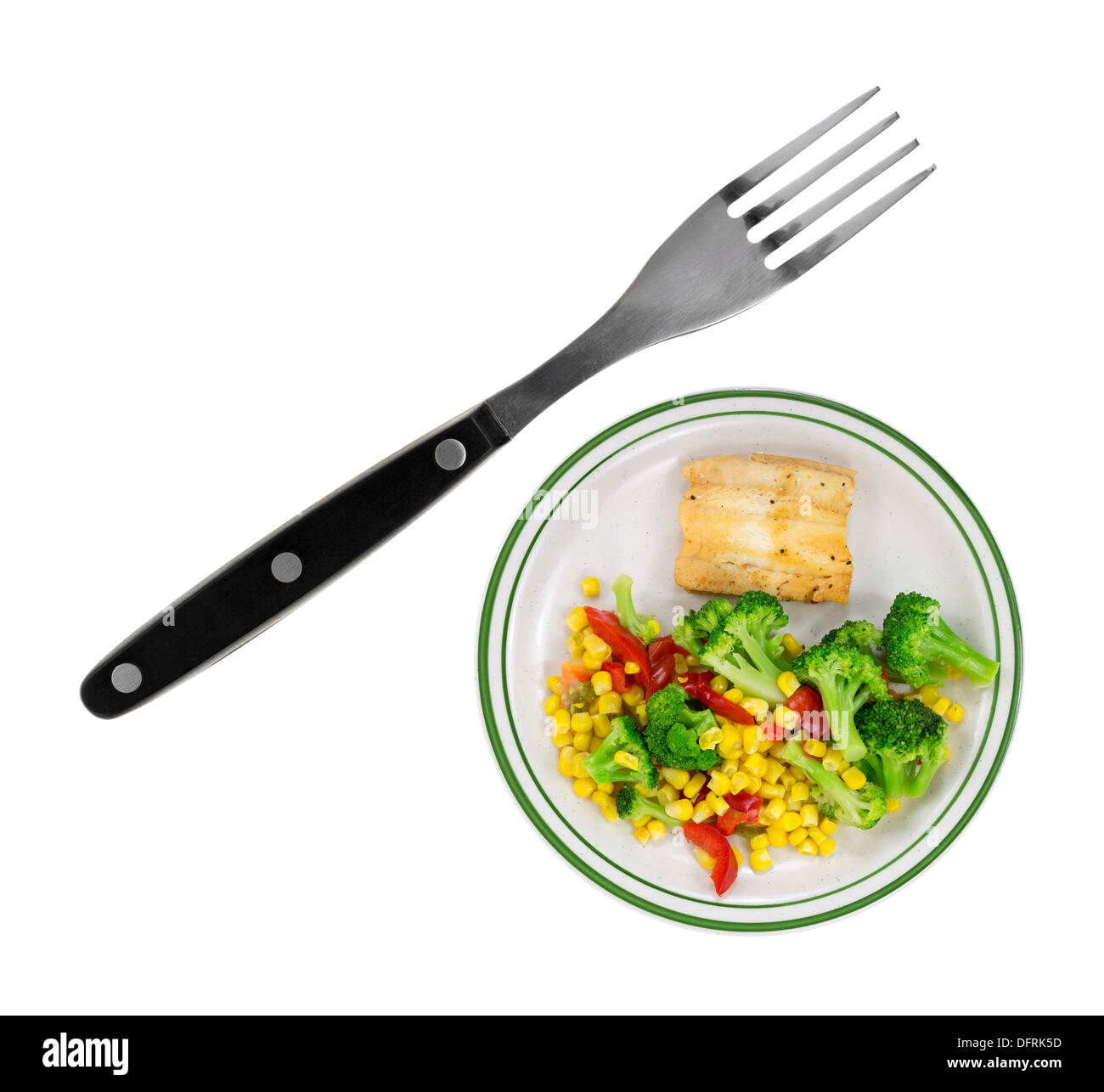 A very small diet meal of haddock and vegetables with an oversize fork ...