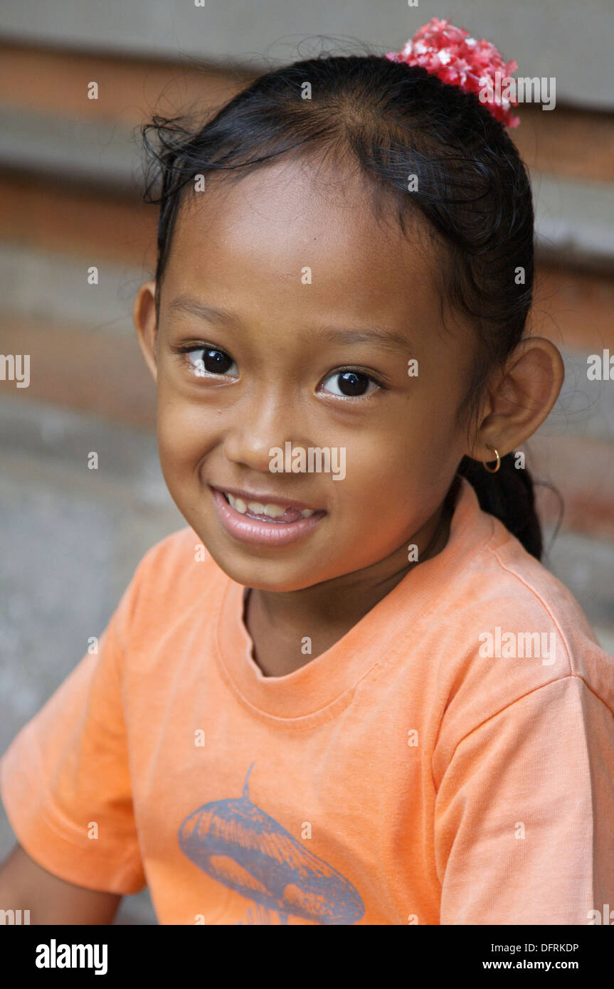 A small Balinese girl with a warm smile in Ubud, Bali Stock Photo - Alamy
