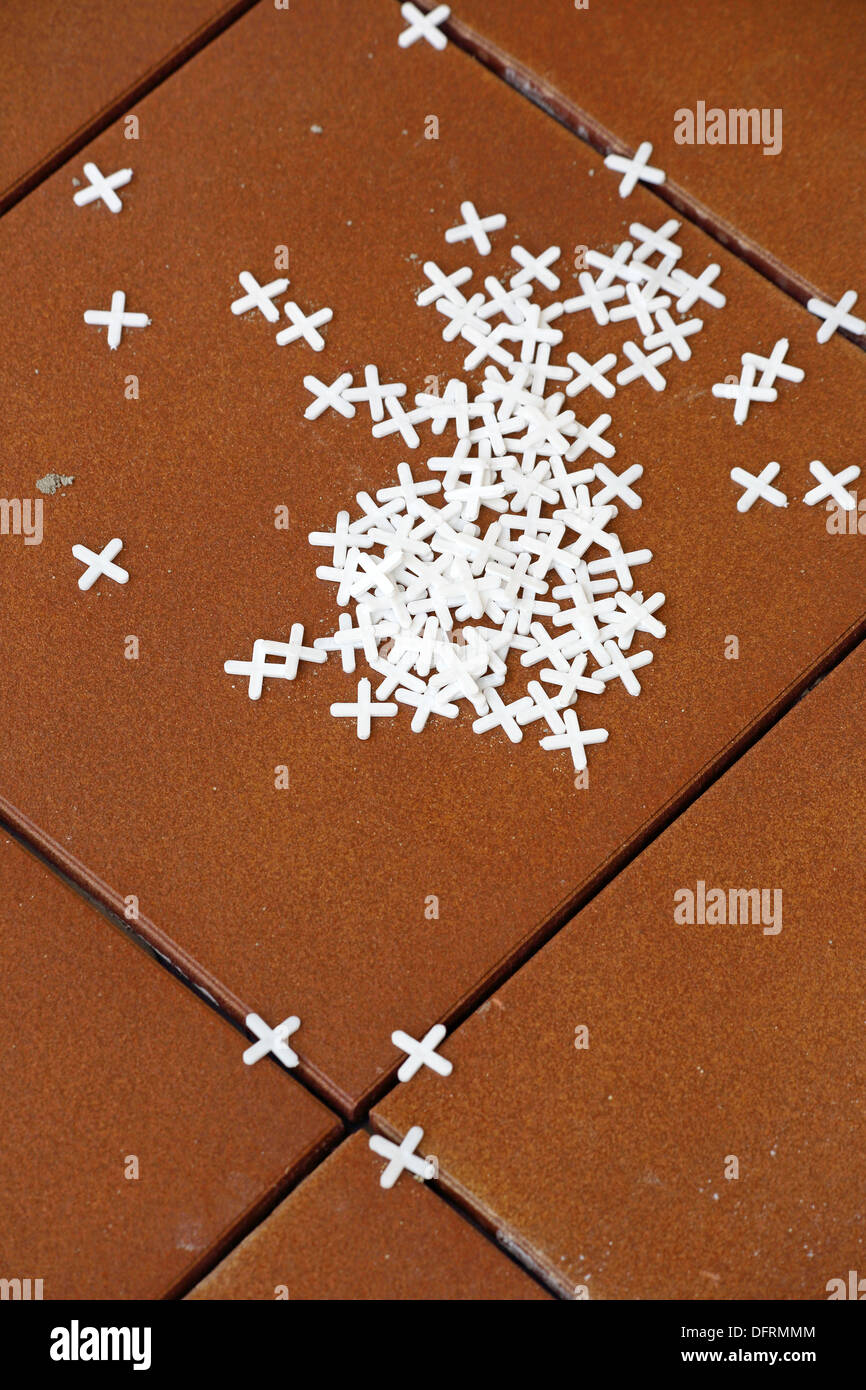 plastic crosses for the installation of ceramic tiles Stock Photo - Alamy