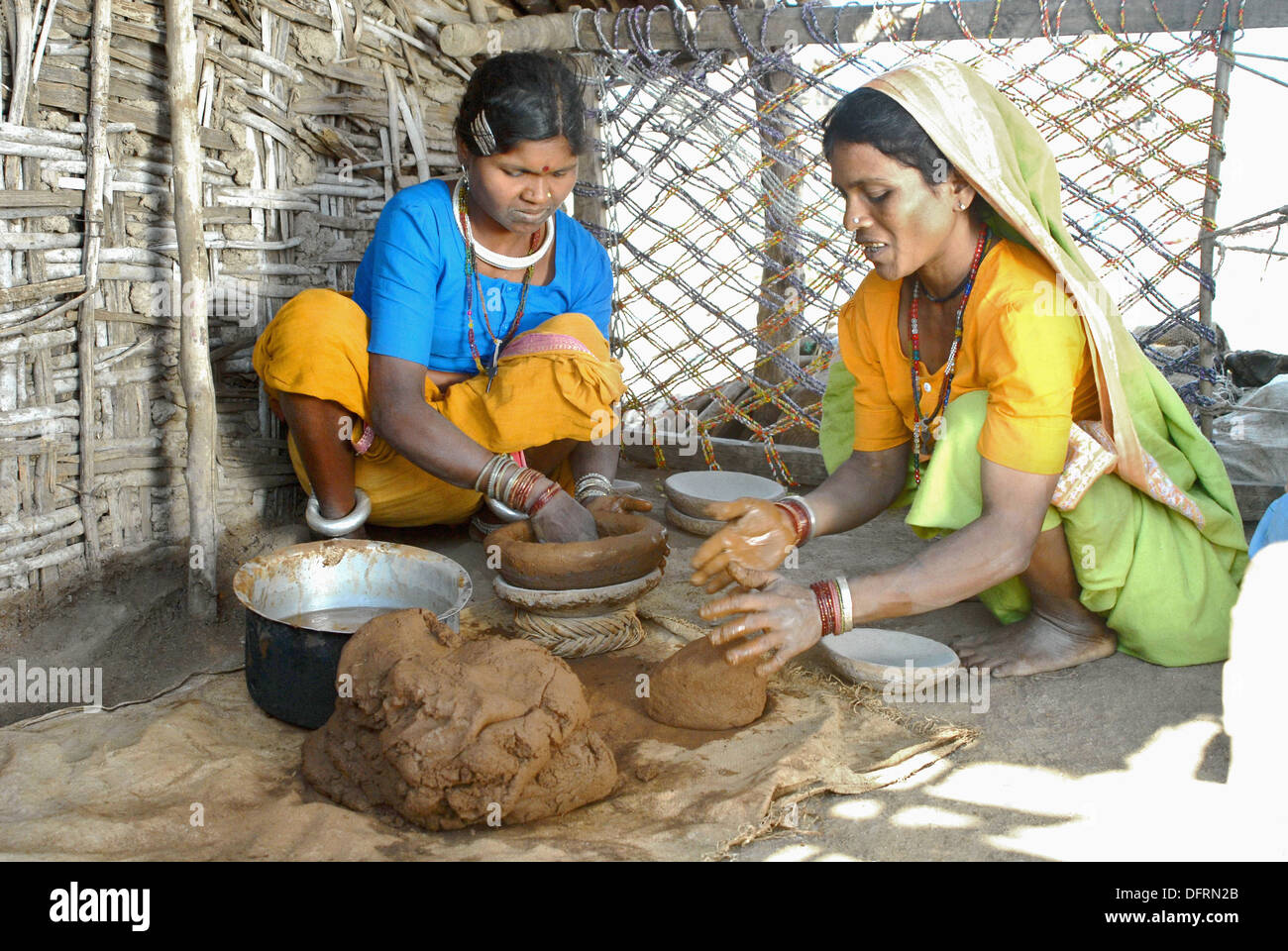 Bareli Tribal women making earthen pots, Madhya Pradesh, India Stock ...