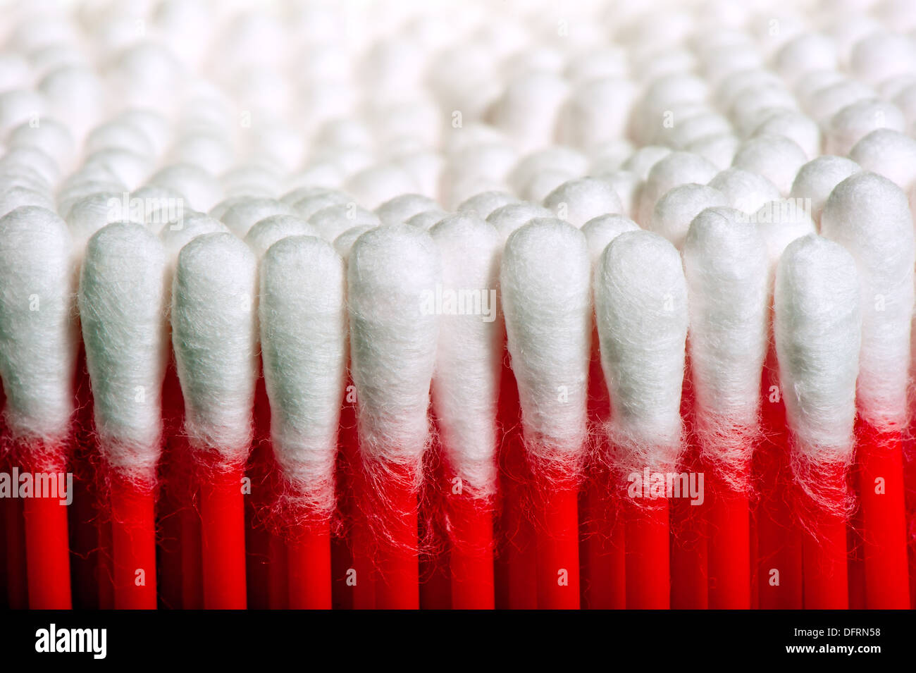 symmetrical rows of clean cotton swabs red Stock Photo - Alamy