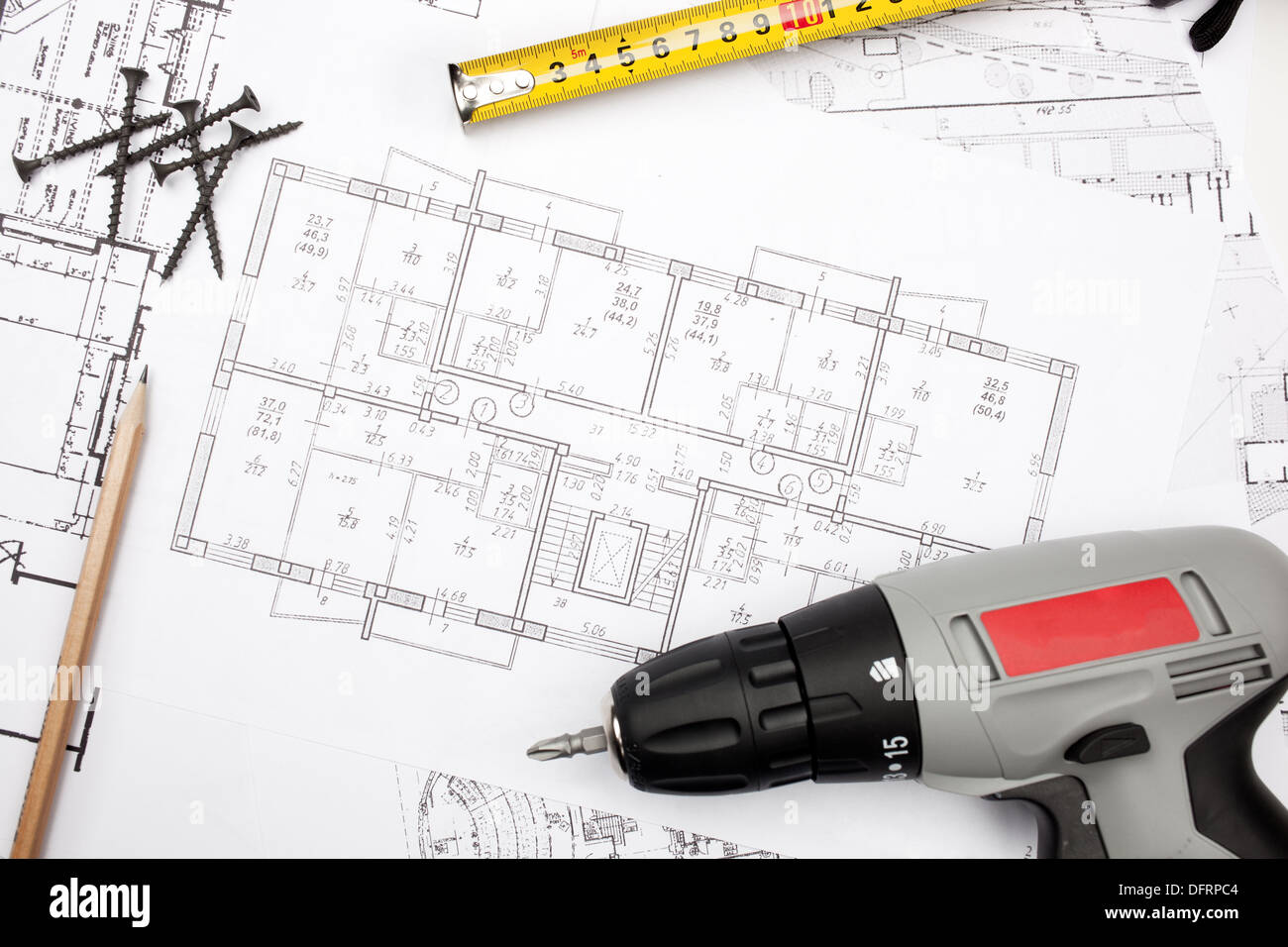 Blueprints with tools Stock Photo - Alamy