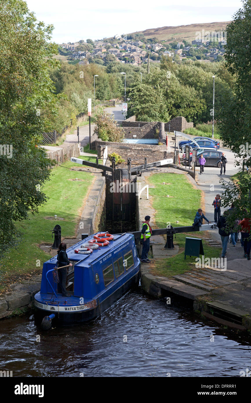 Marsden shuttle boat at Marsden lock on the Huddersfield Narrow Canal ...