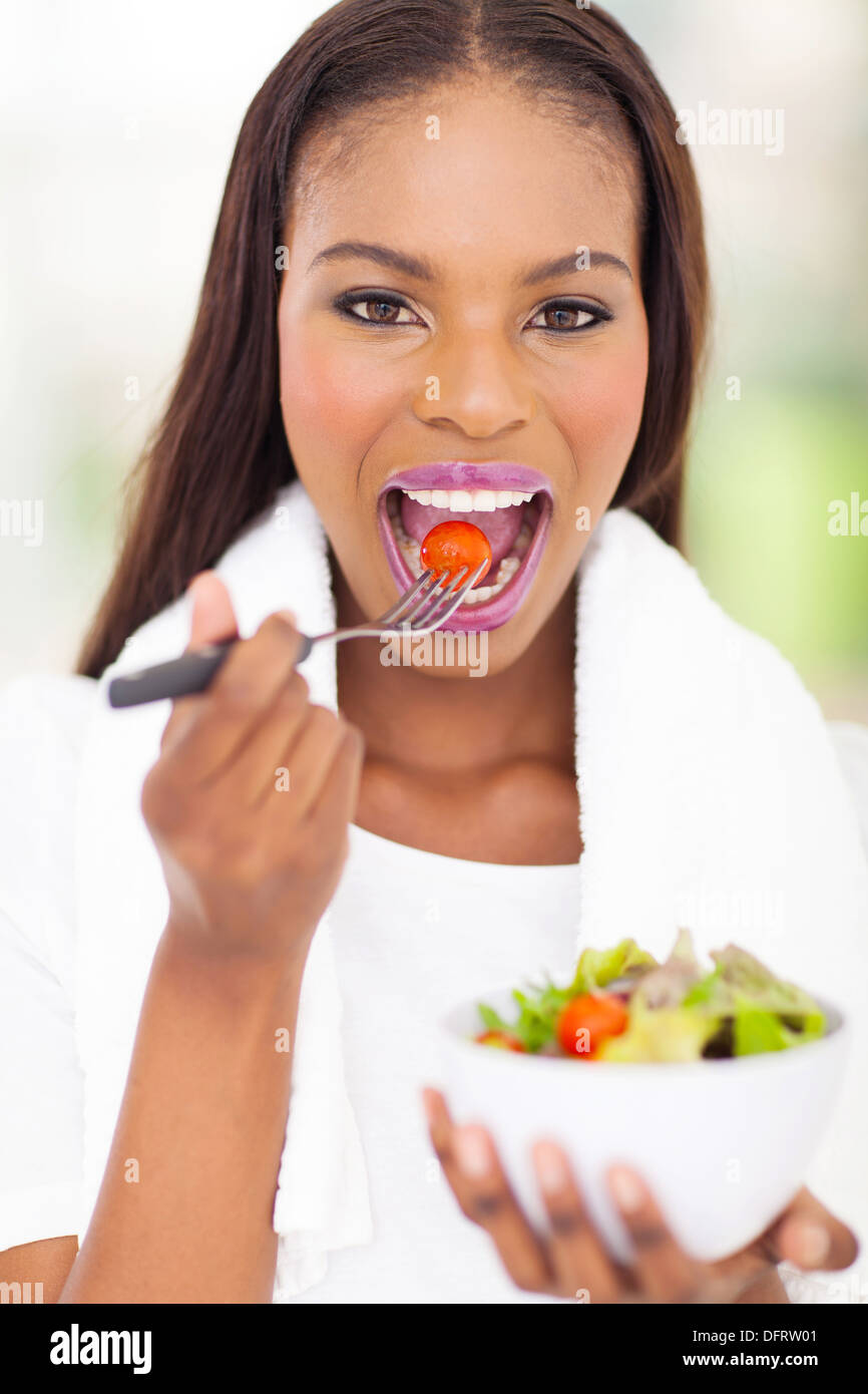 Young woman eating salad workout hi-res stock photography and images ...